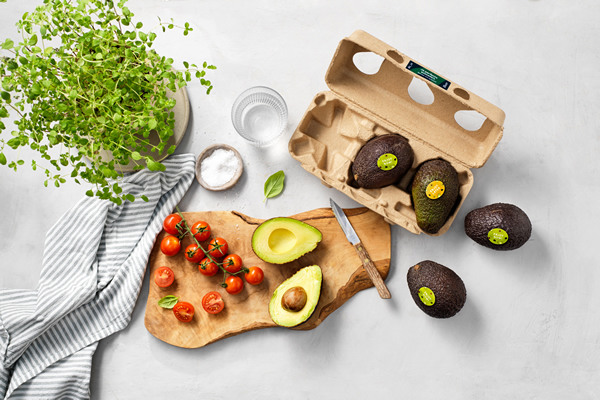 Three avocados at different stages of ripening in one 'avocado box'